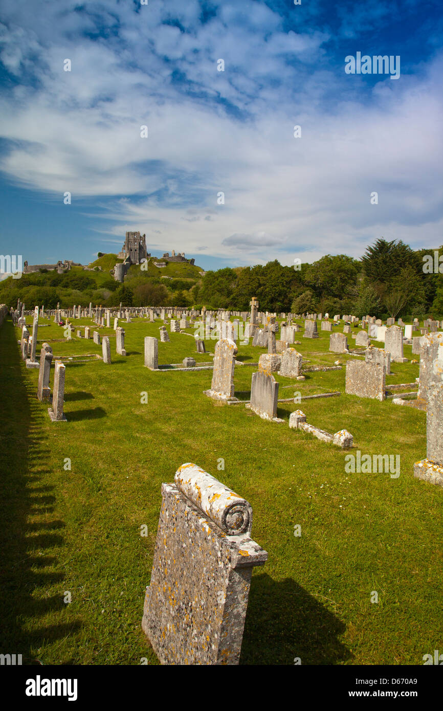 The Castle ruins as seen from the cemetery in Corfe Castle village ...