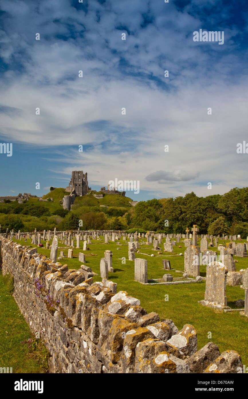 The Castle ruins as seen from the cemetery in Corfe Castle village ...