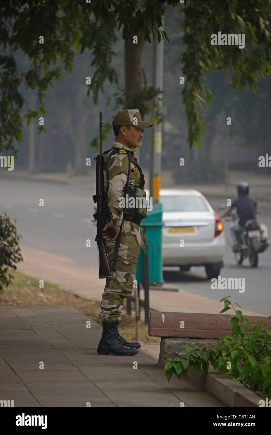 An armed Tibetan soldier on security guard duty by the Mahatma Gandhi ...