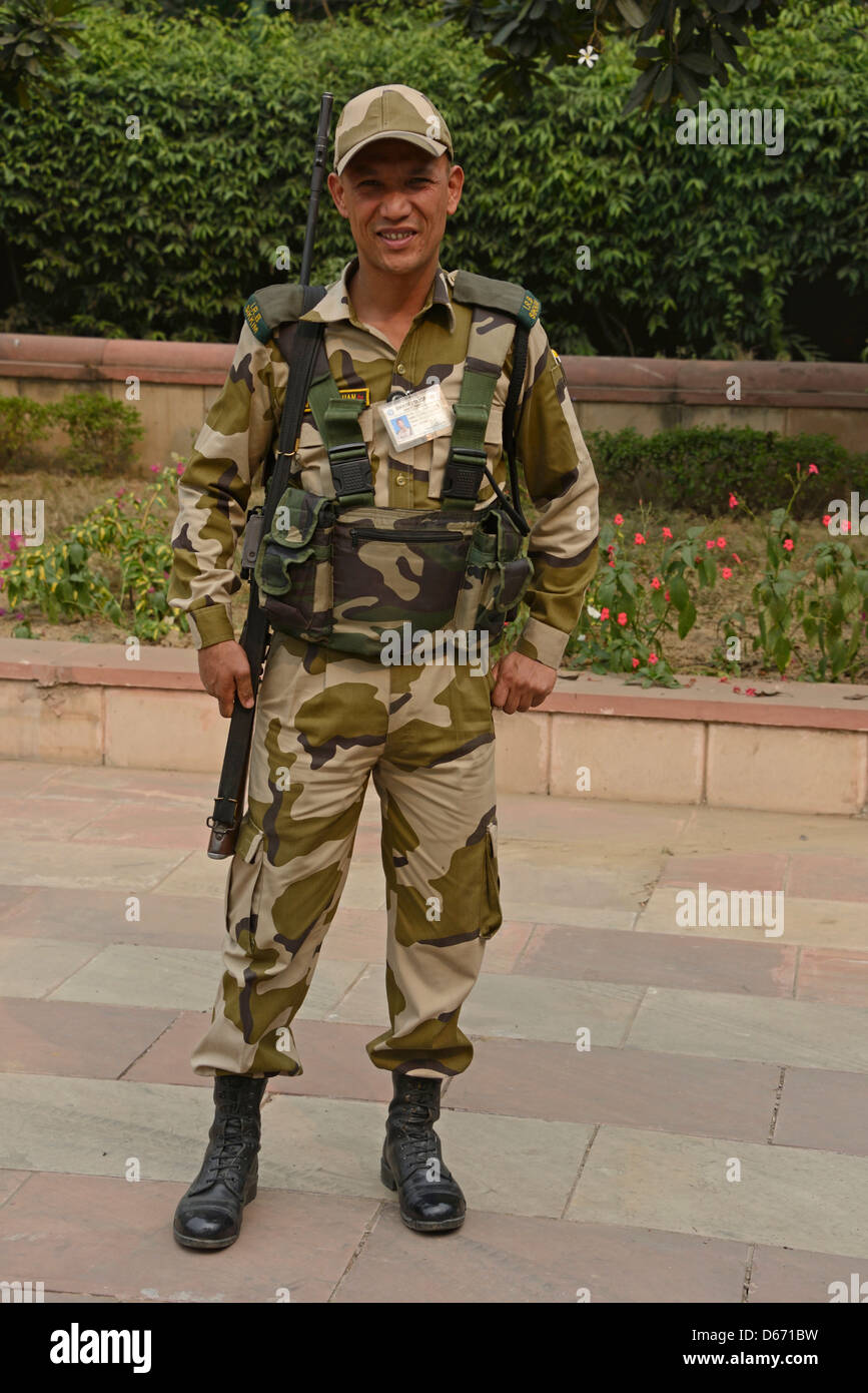 An armed Tibetan soldier on security guard duty by the Mahatma Gandhi ...