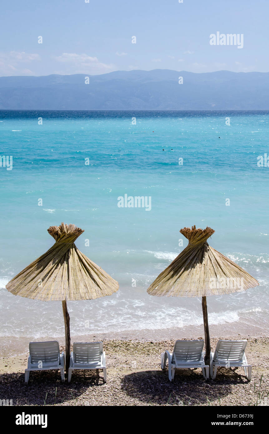 Sunbeds umbrella reed ocean beach hi-res stock photography and images ...
