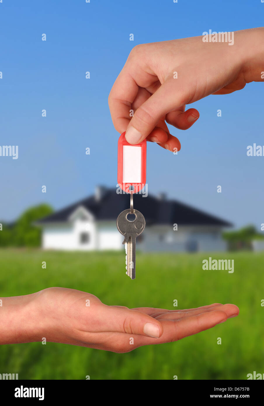 Hands with Key to New House Stock Photo - Alamy