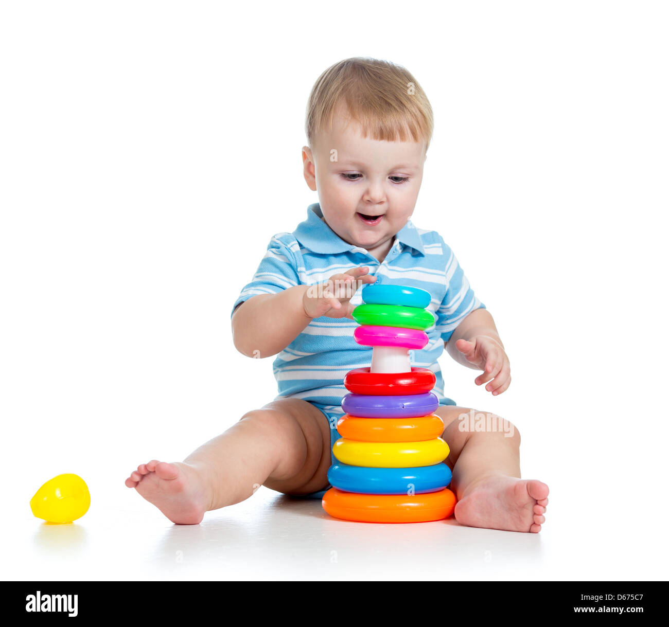 funny baby boy playing with colorful toy isolated on white Stock Photo ...