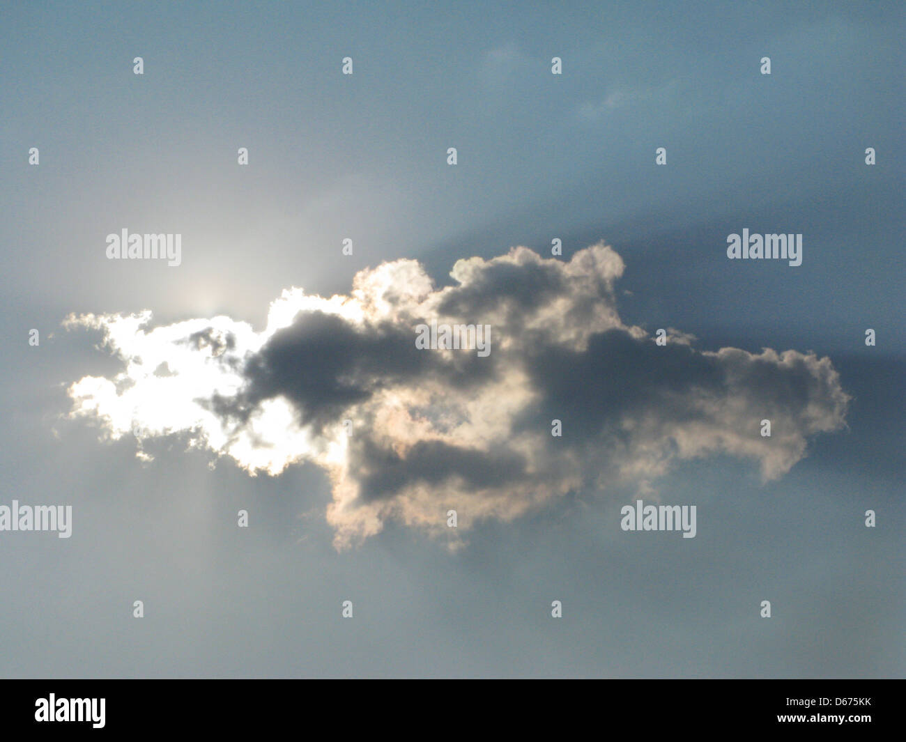 Sun behind a cloud Stock Photo - Alamy