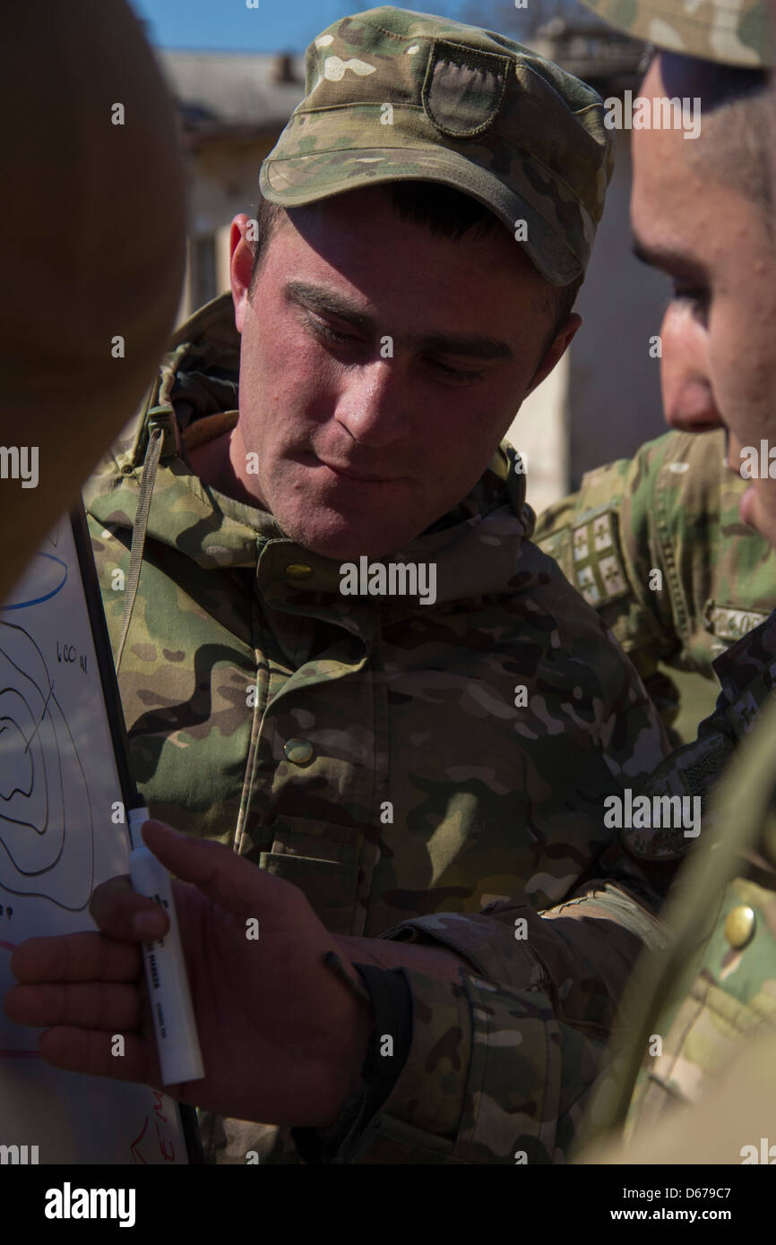 A professional military education (PME) training class discusses ...