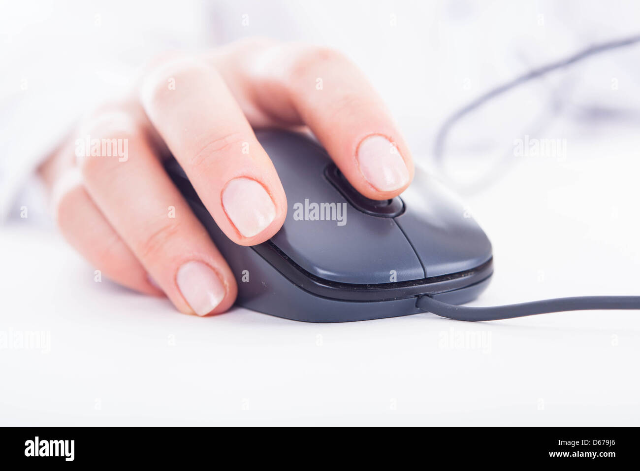 Isolated female hand on the mouse Stock Photo - Alamy