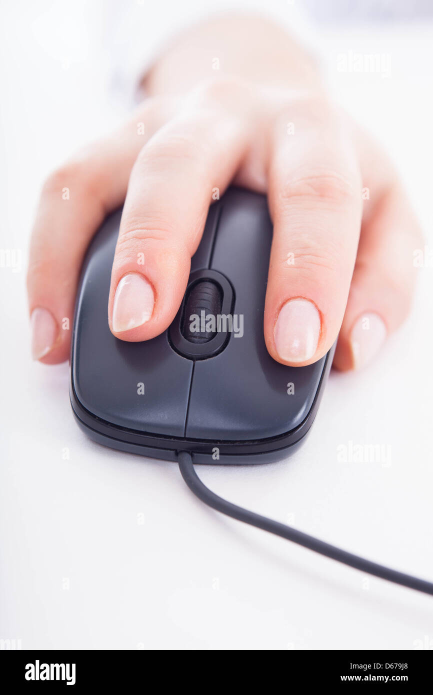 Isolated female hand on the mouse Stock Photo - Alamy