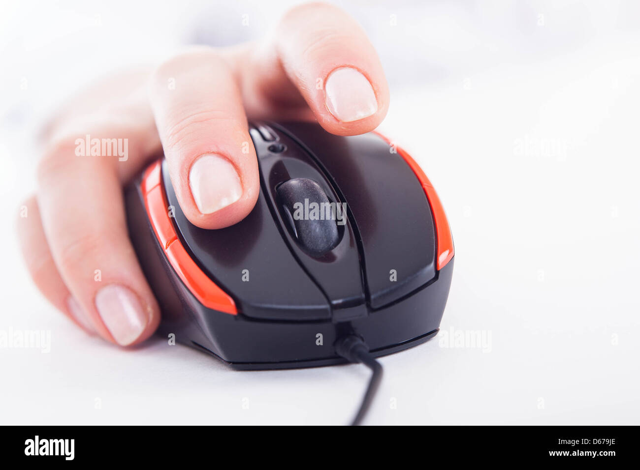 Isolated female hand on the mouse Stock Photo - Alamy