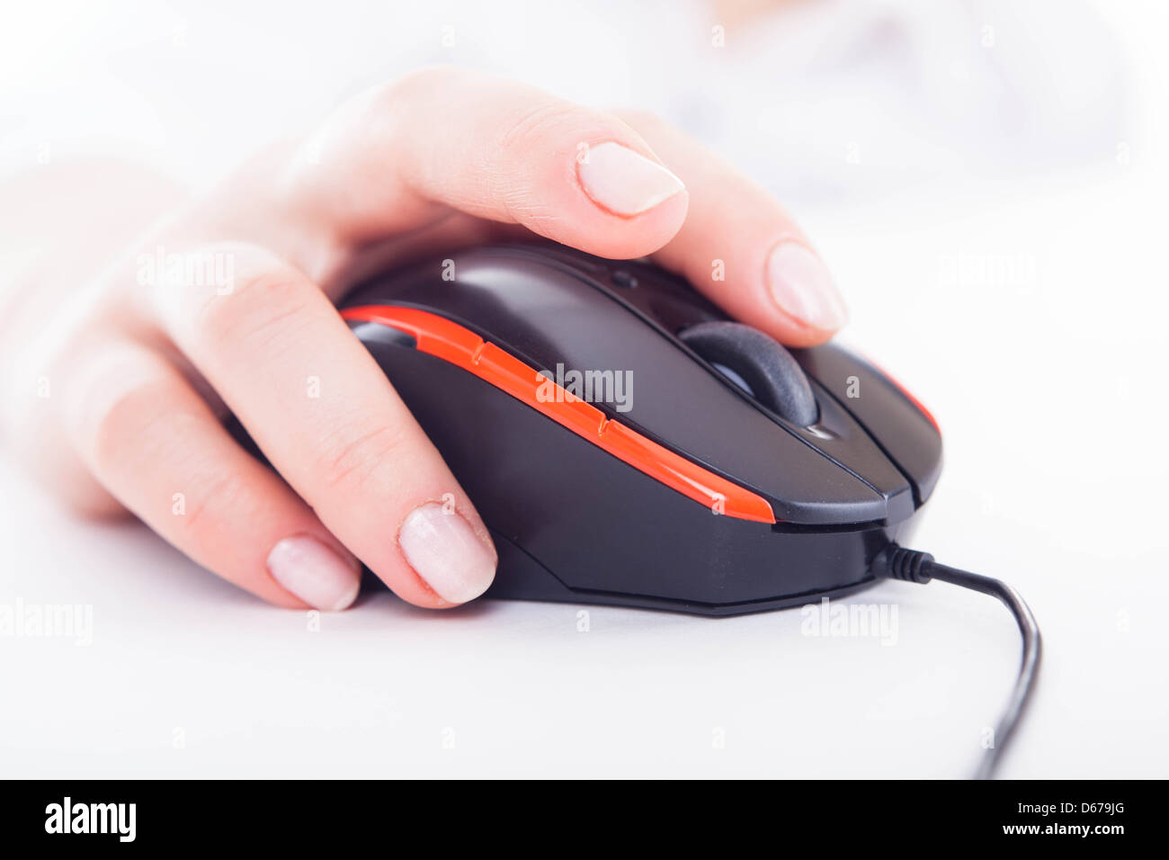 Isolated female hand on the mouse Stock Photo - Alamy