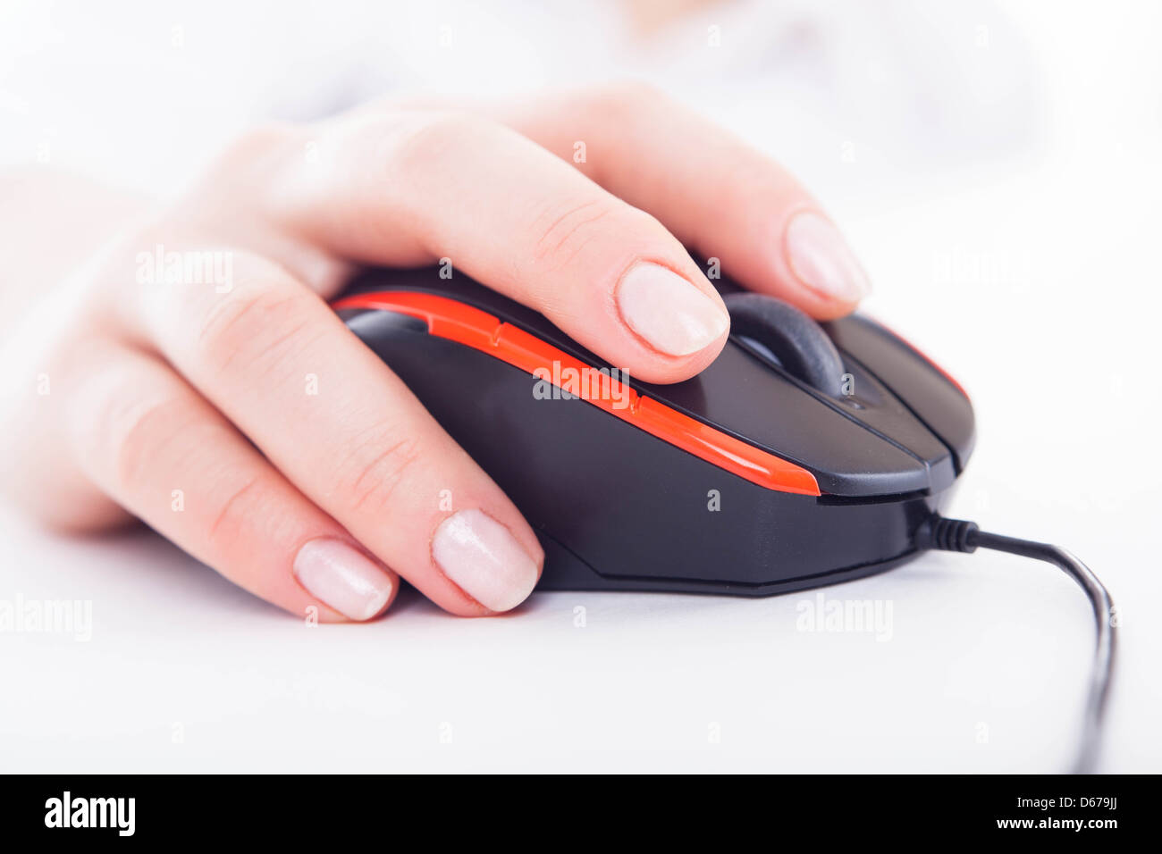 Isolated female hand on the mouse Stock Photo - Alamy