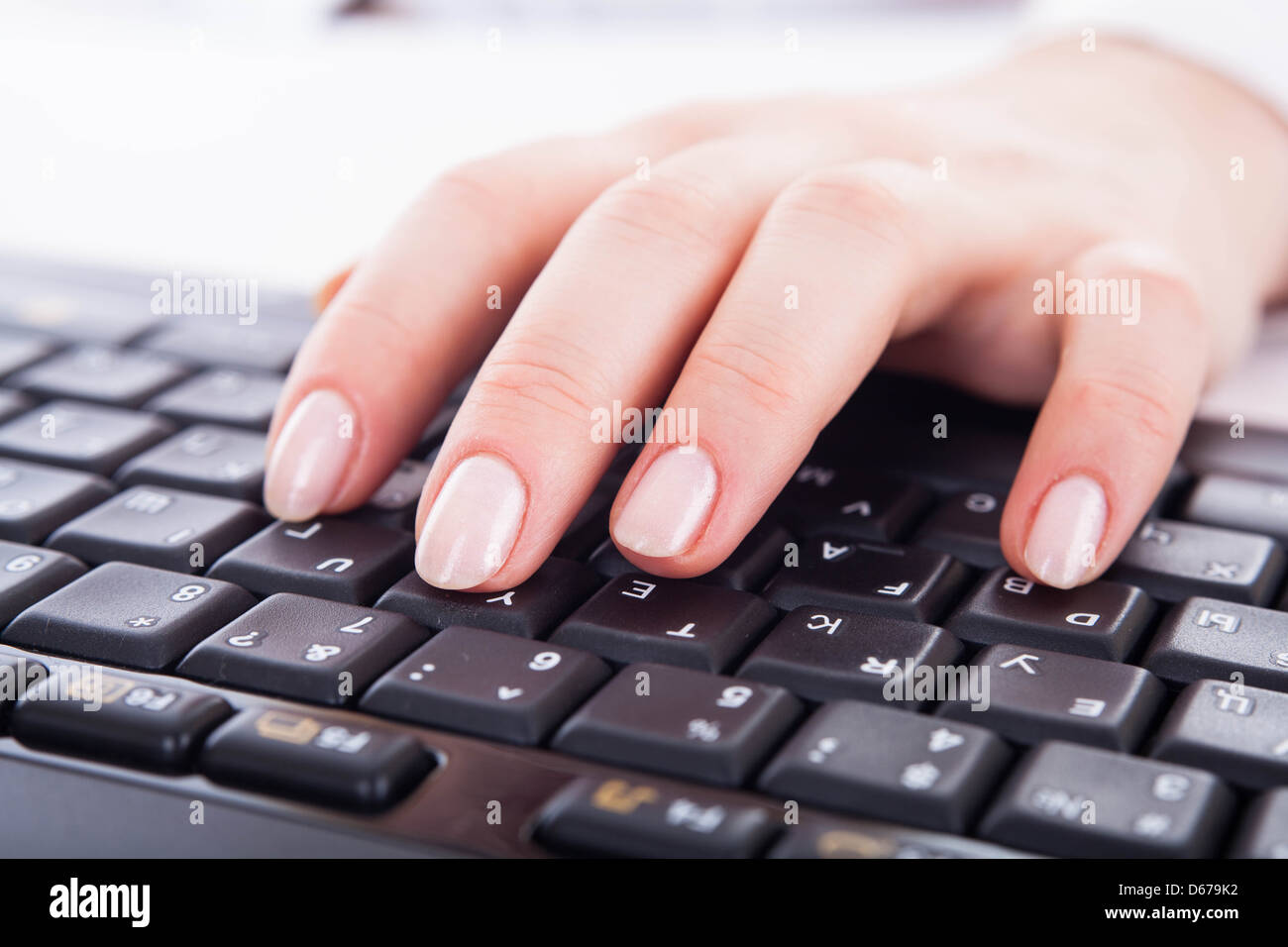 Hands on the black keyboard in the closeup Stock Photo - Alamy