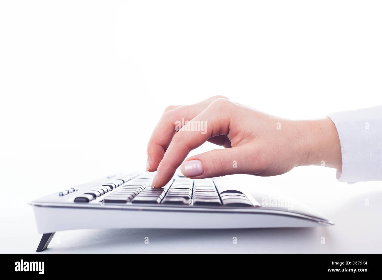 Female hand on the black keyboard on the white Stock Photo - Alamy