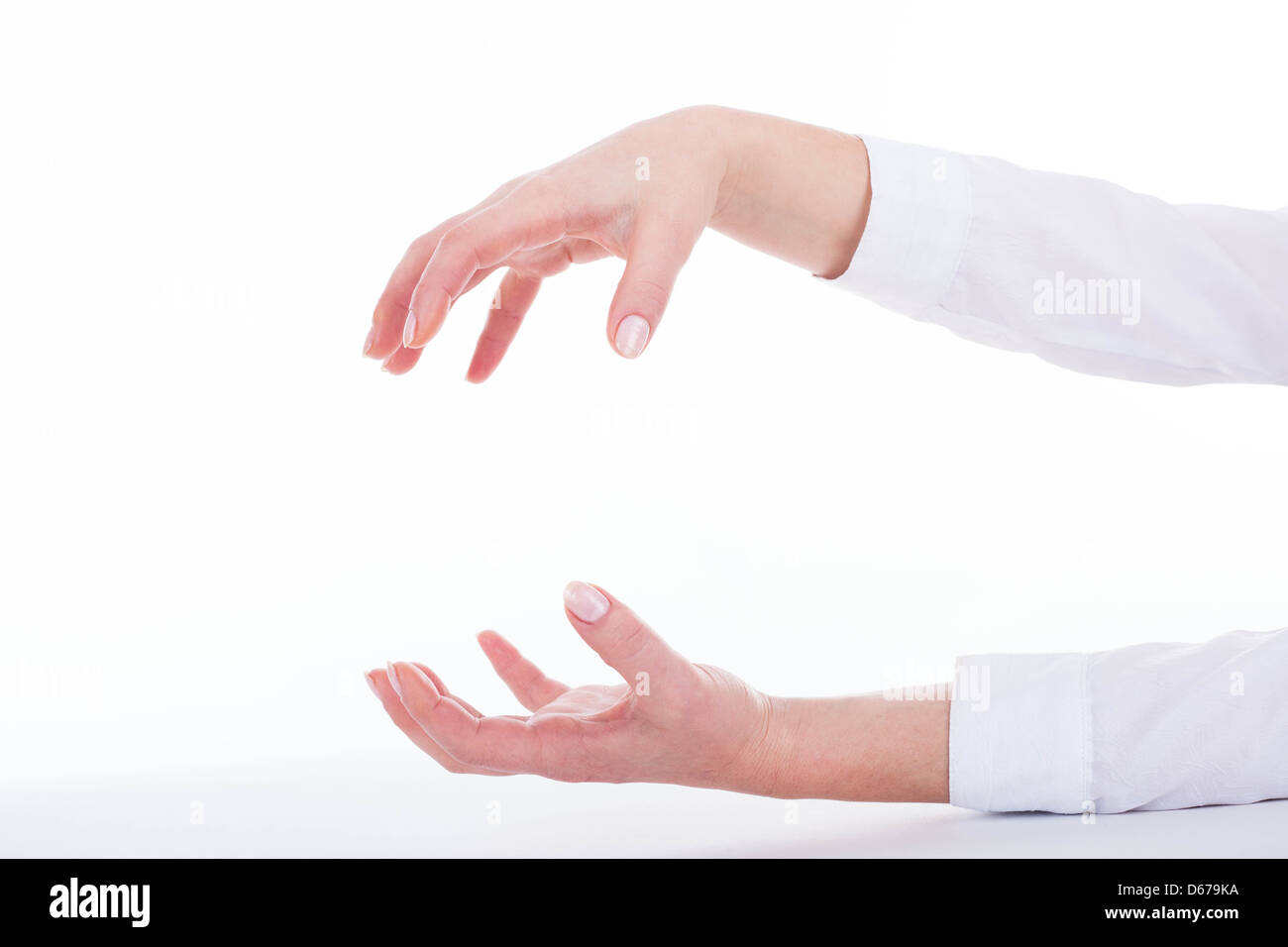 Isolated female hands in grasping gesture Stock Photo - Alamy