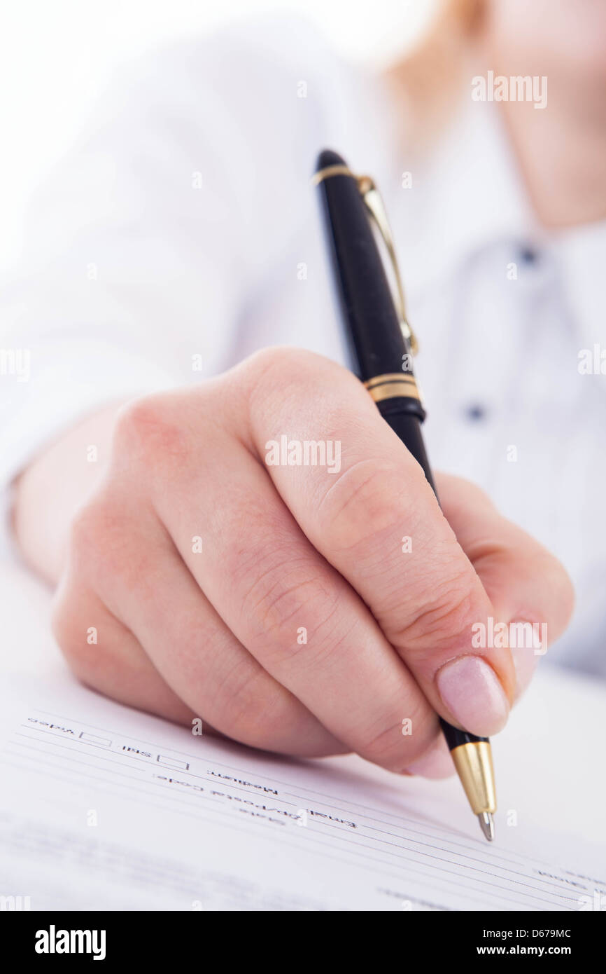 Hand filling out the form on white Stock Photo - Alamy