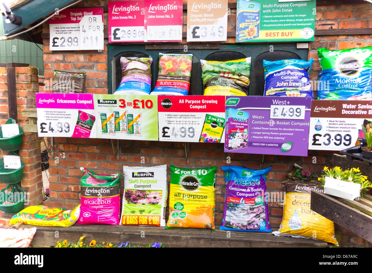 A garden centre display showing the many types of compost available for ...