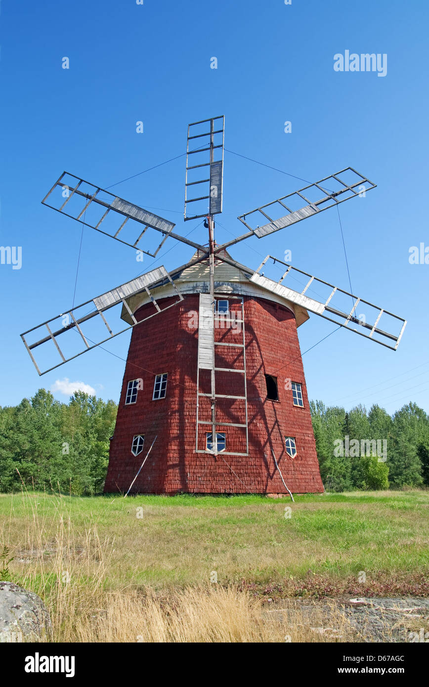 Traditional old wooden windmill painted in red color Stock Photo - Alamy
