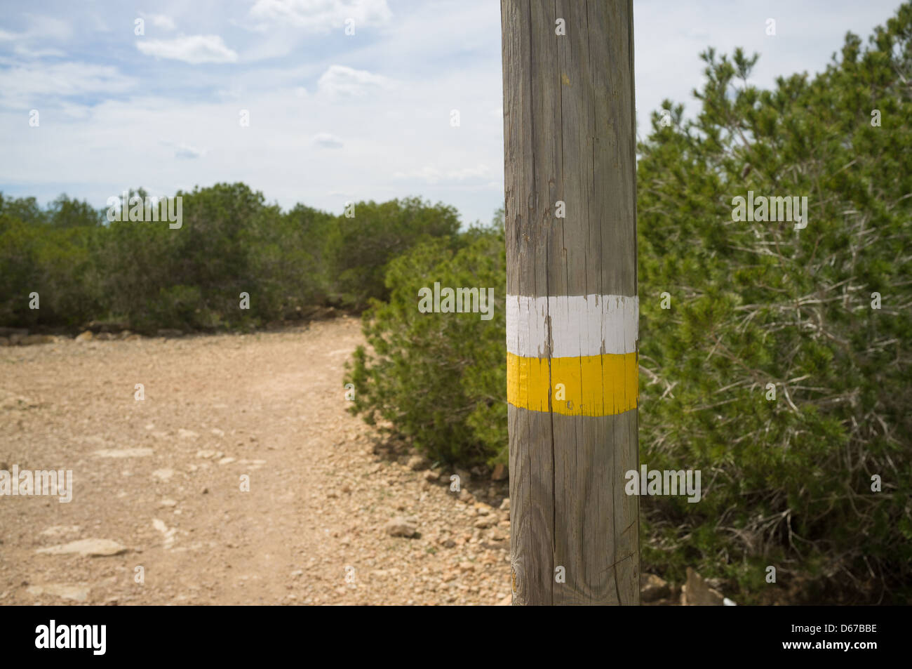 Hiking trail marked by a wooden pole Stock Photo - Alamy