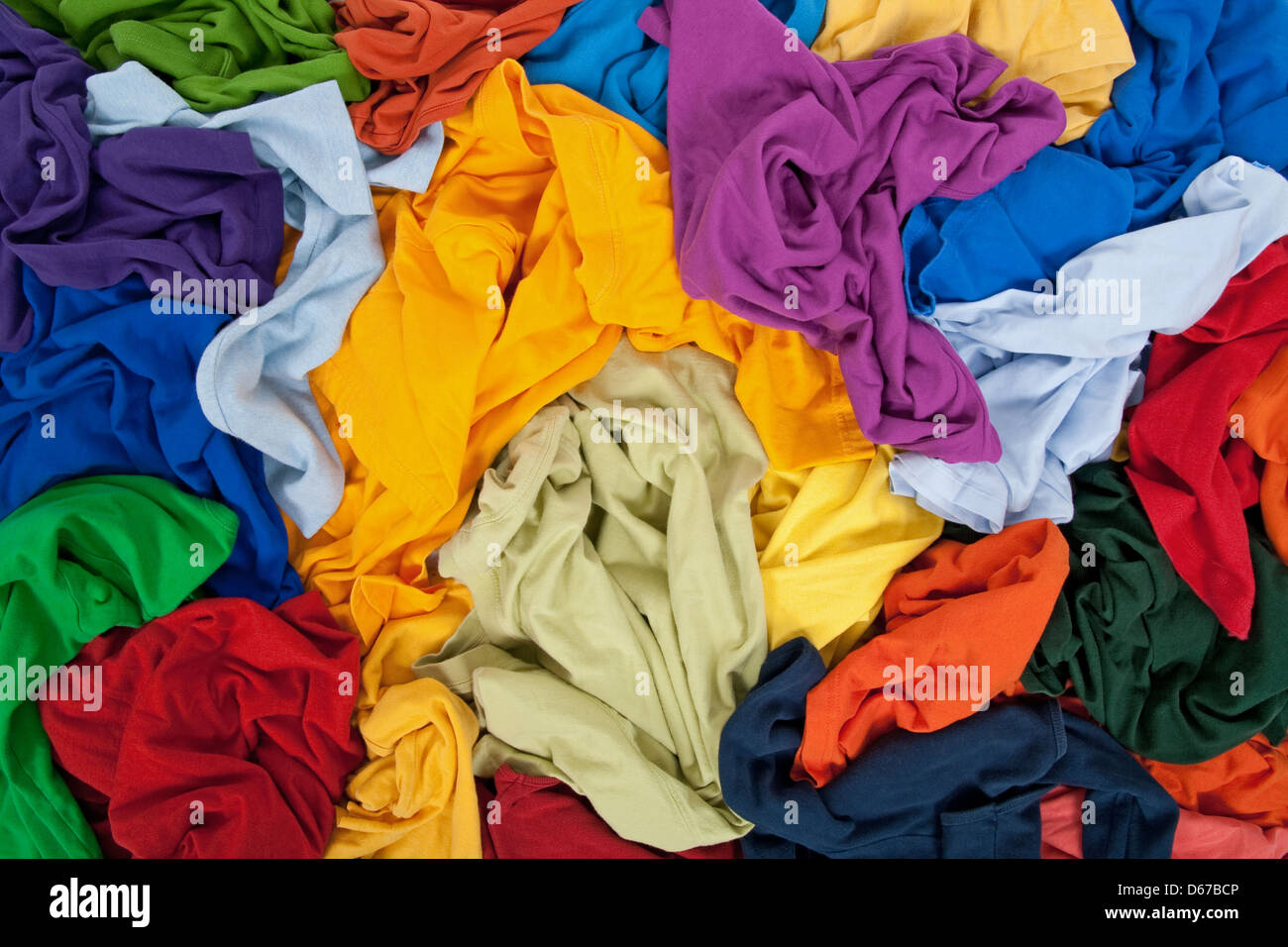 Lots of bright messy colorful clothing, abstract background Stock Photo ...