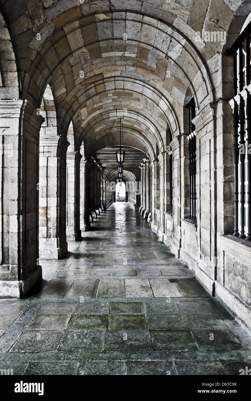 corridor with arches and stone columns outside the cathedral Stock ...