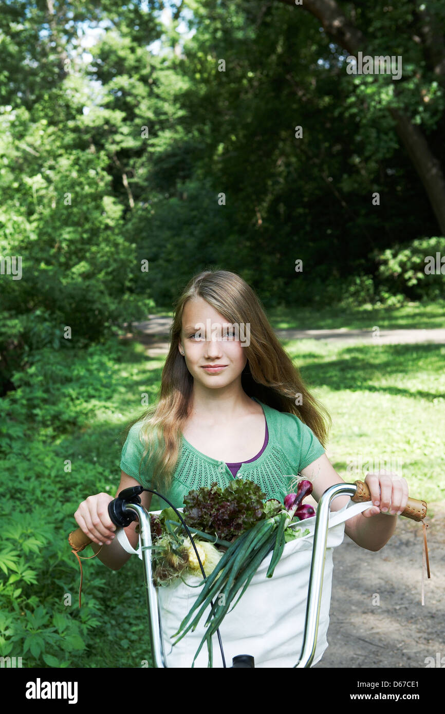girl riding bike home from farmers market Stock Photo - Alamy