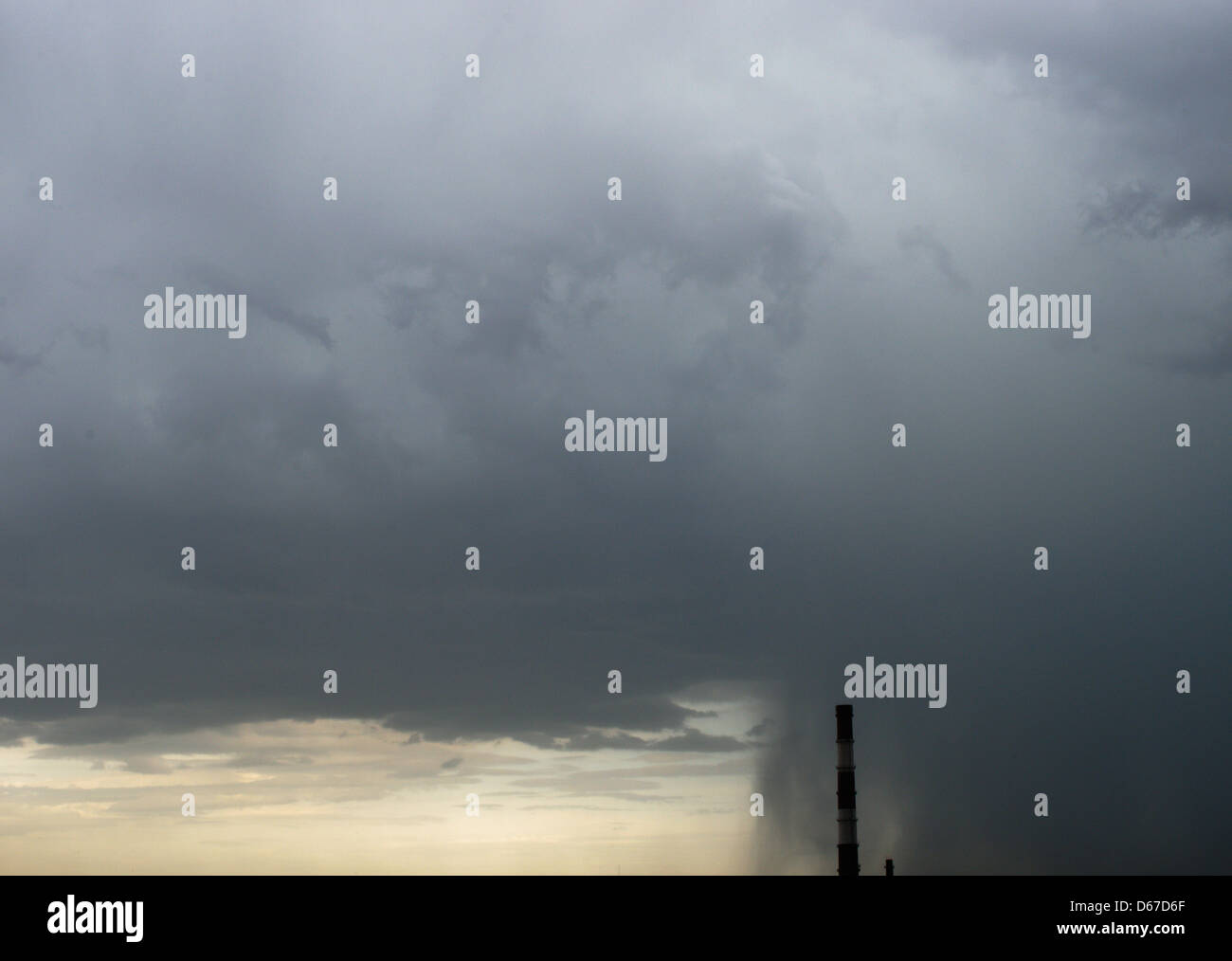 This image captures a dramatic sky with rain clouds and thunderous ...