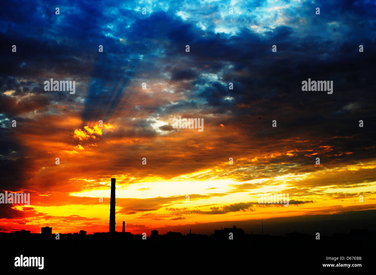 This image captures a sunrise with vivid colors in the sky and clouds ...