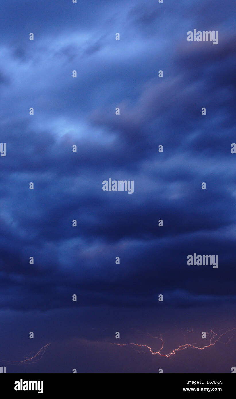 A long exposure photograph of lightning in the sky, captured with a ...