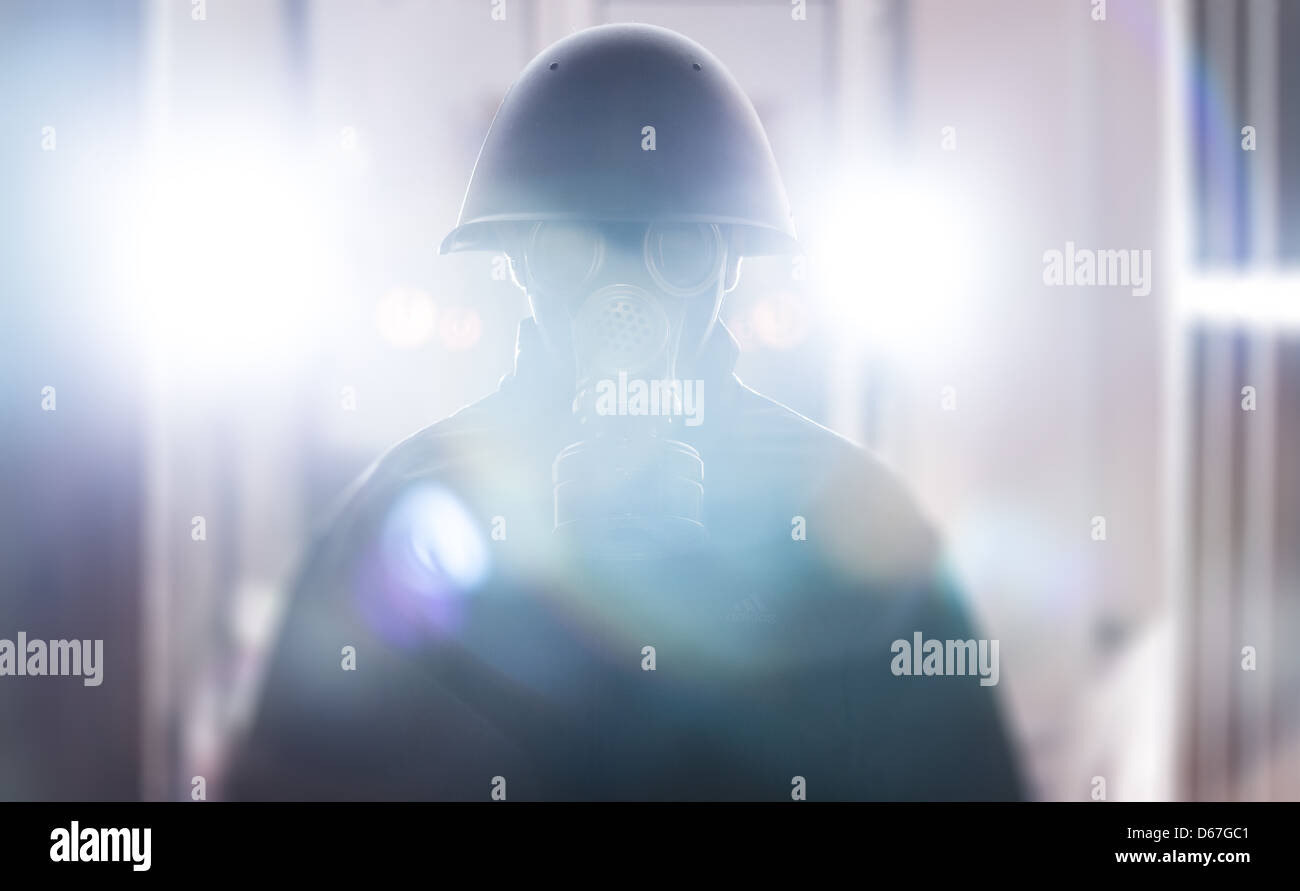 A man in military helmet and gas mask Stock Photo - Alamy