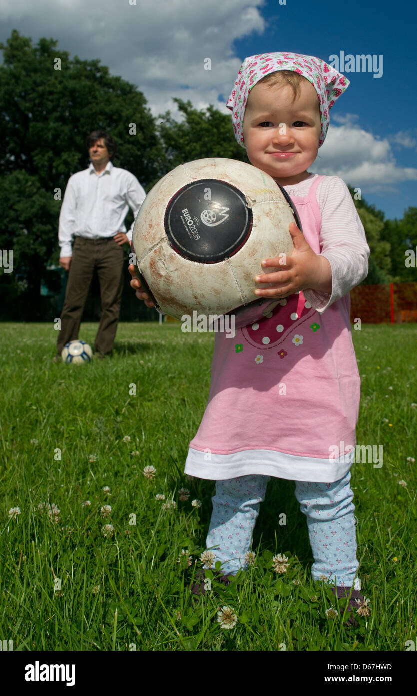 Two-year-old Anna Marie proudly presents her soccer ball in Pillgram ...