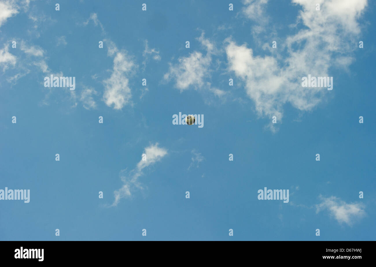 A soccer ball is shot into the sky in Pillgram, Germany, 17 June 2012 ...