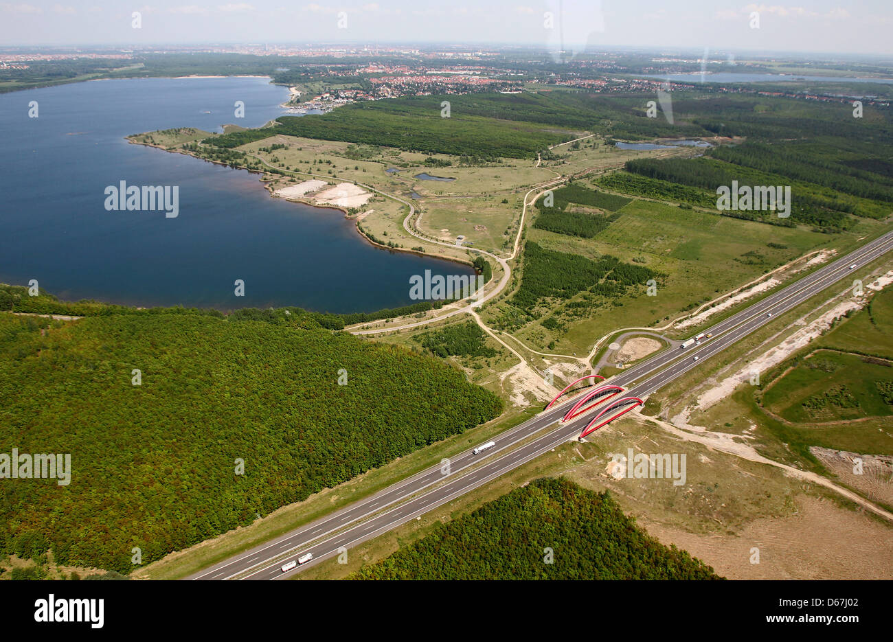 Aerial view of an area below motorway A38 marked to become a channel ...