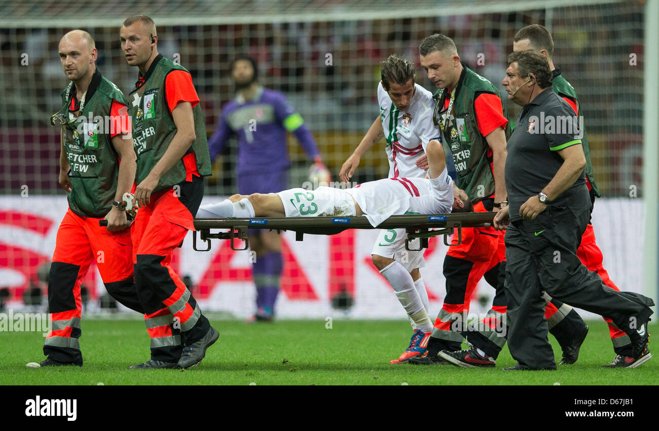 Helder Postiga of Portugal is carried off the pitch on a stretcher ...