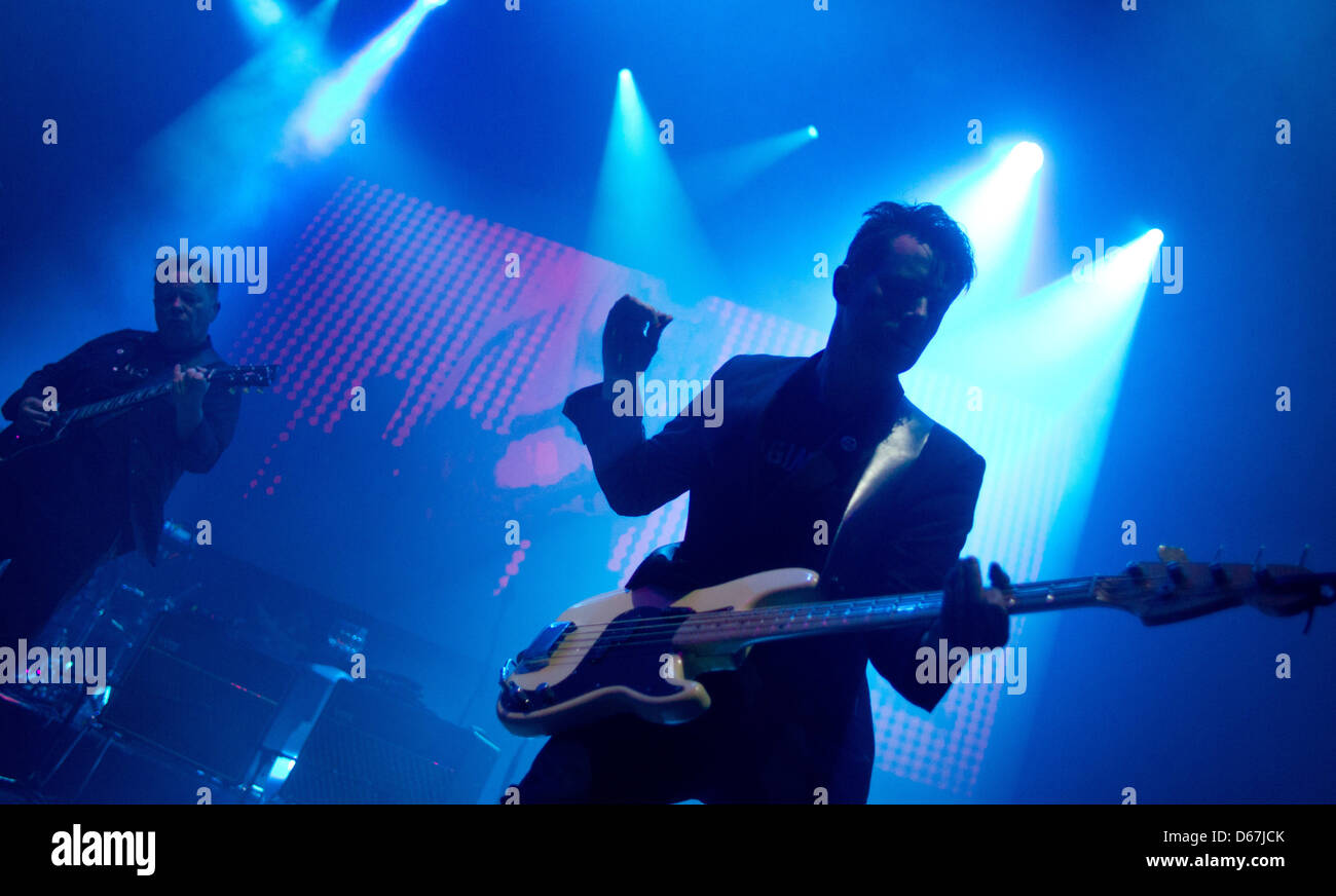 The new bassist Tom Chapman plays next to frontman Bernhard Sumner of ...