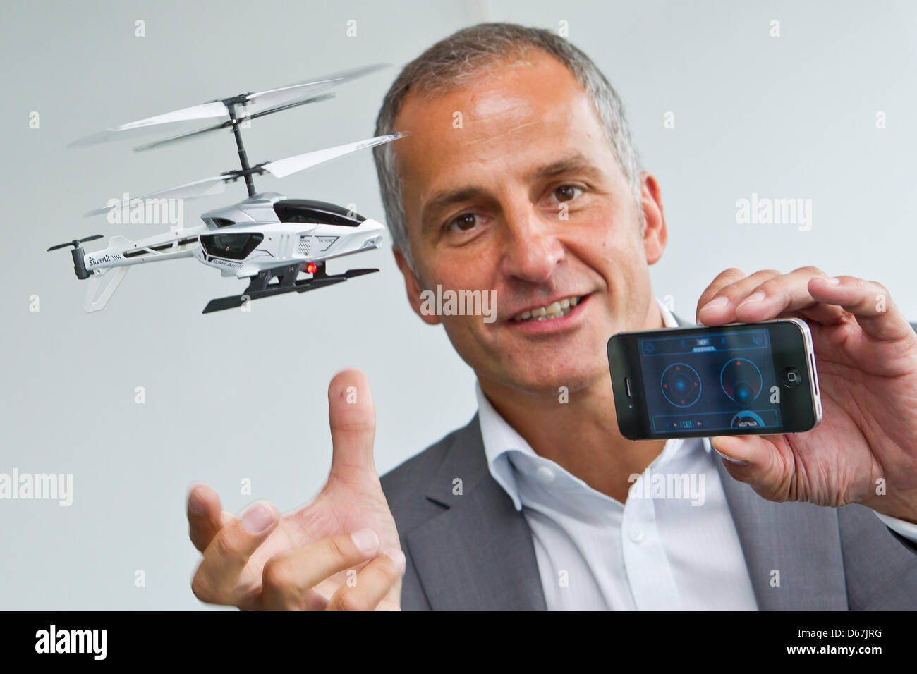 The head of the Vedes AG, Achim Weniger, presents a toy helicopter by Silverlit, which is ...