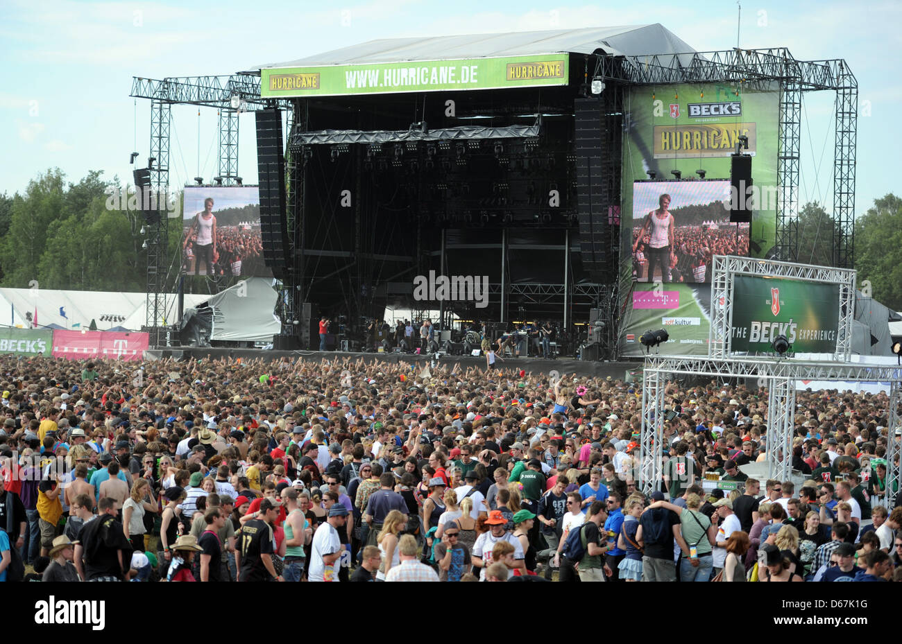 Music fans stand in front of a stage at the Hurricane festival in ...