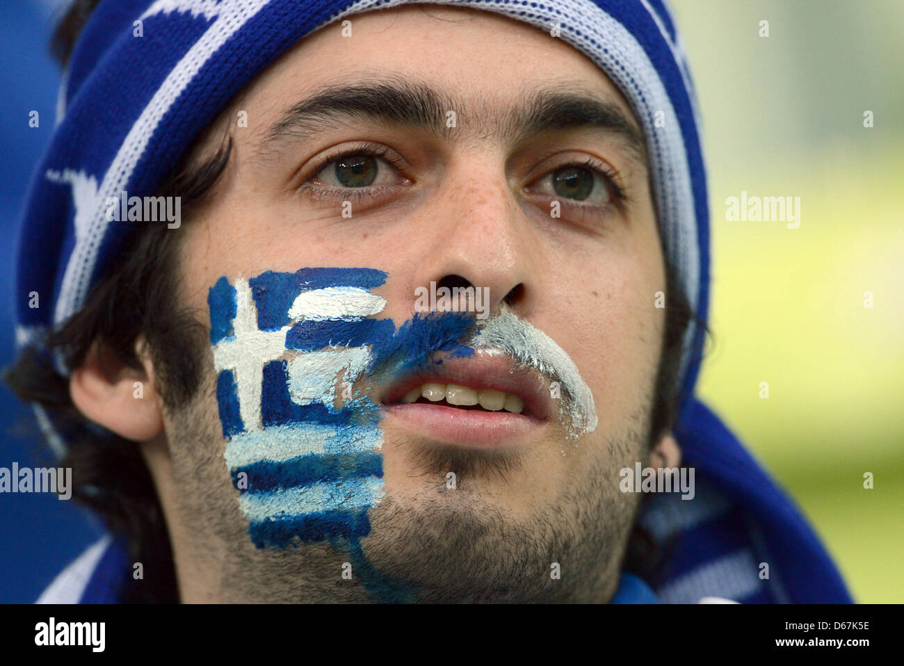 A Greek supporter celebrates on the stand prior to the UEFA EURO 2012 ...
