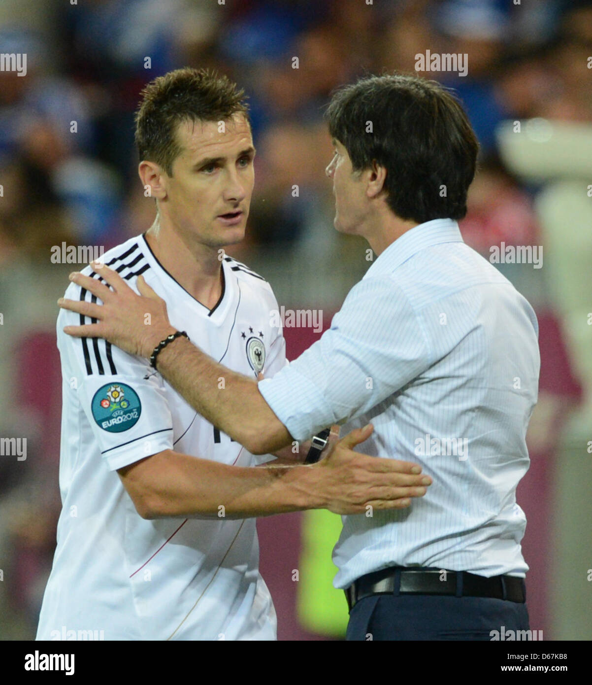 Germany's Miroslav Klose (L) embraces coach Joachim Loew after he was ...