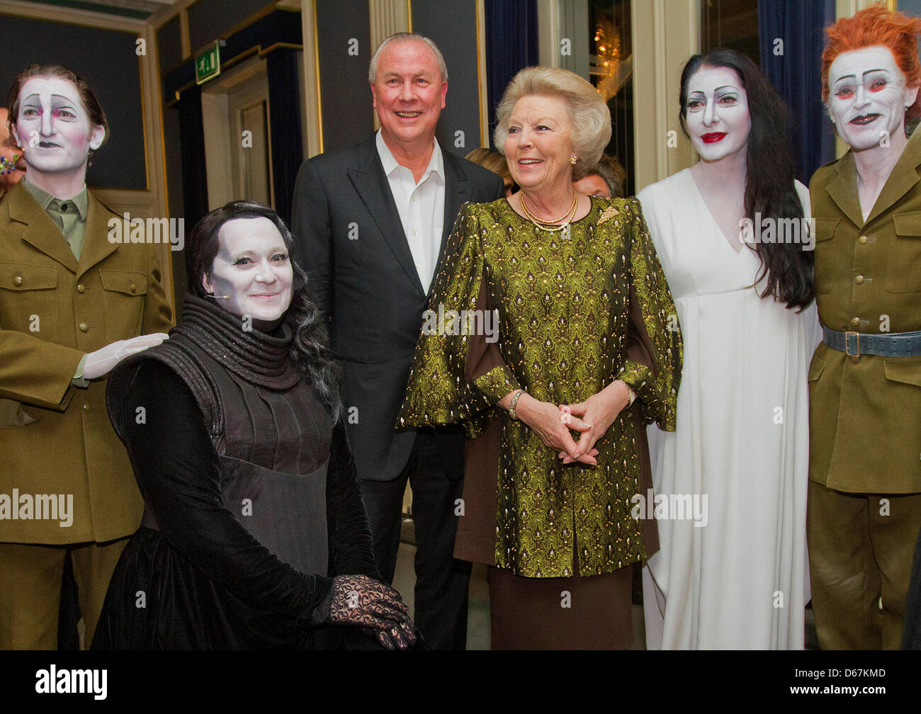 Queen Beatrix of The Netherlands (C) poses with British singer and ...