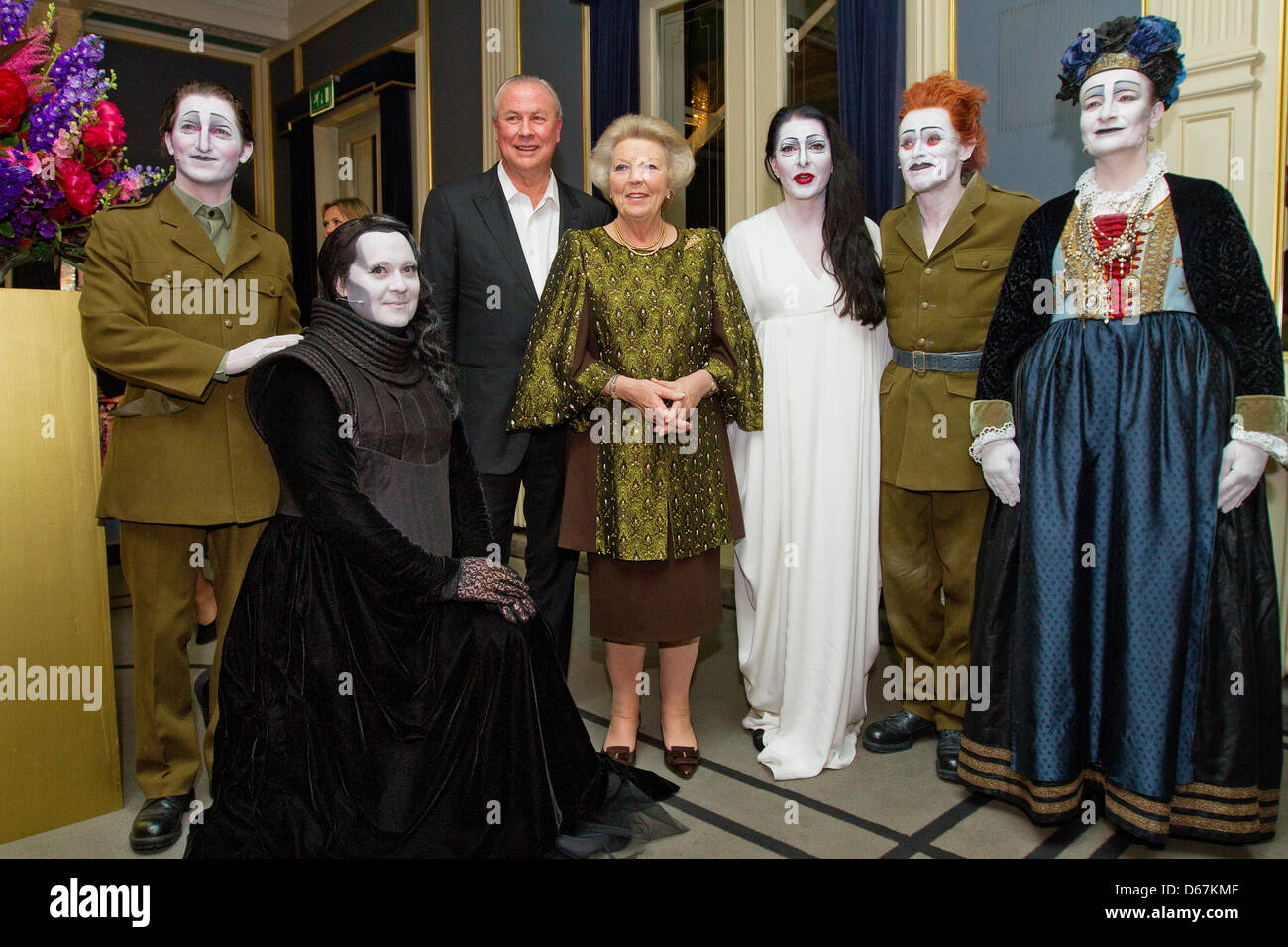 Queen Beatrix of The Netherlands (C) poses with British singer and ...