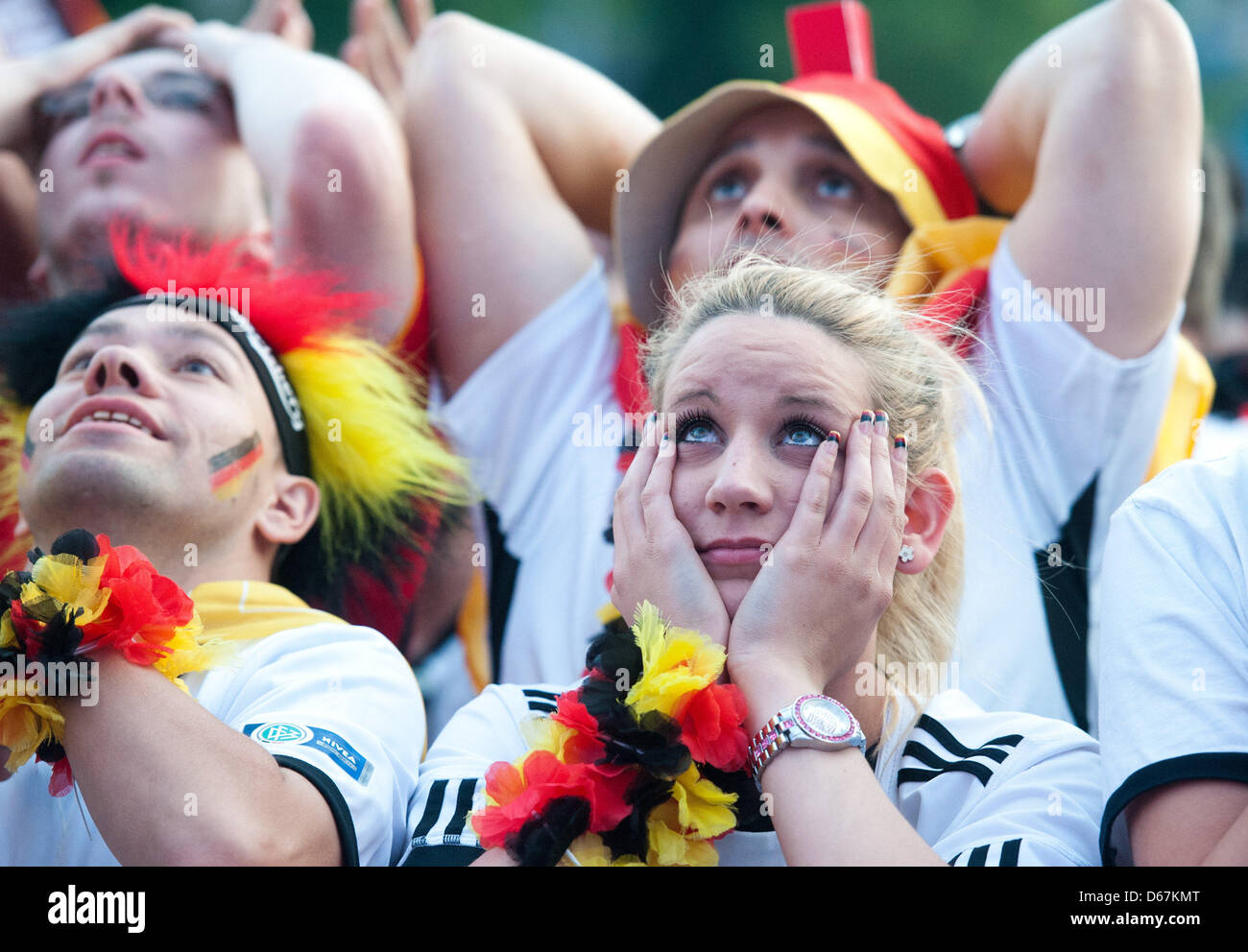 Soccer fans watch the UEFA EURO 2012 quarter final soccer match Germany ...