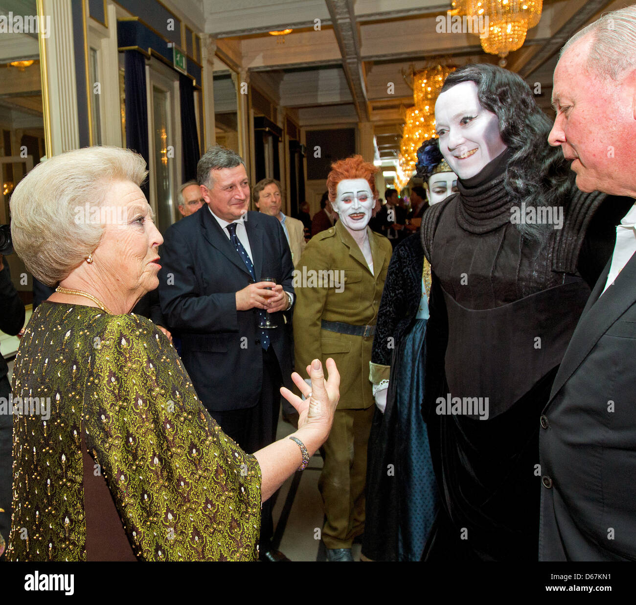 Queen Beatrix of The Netherlands (L) speaks with British singer and ...