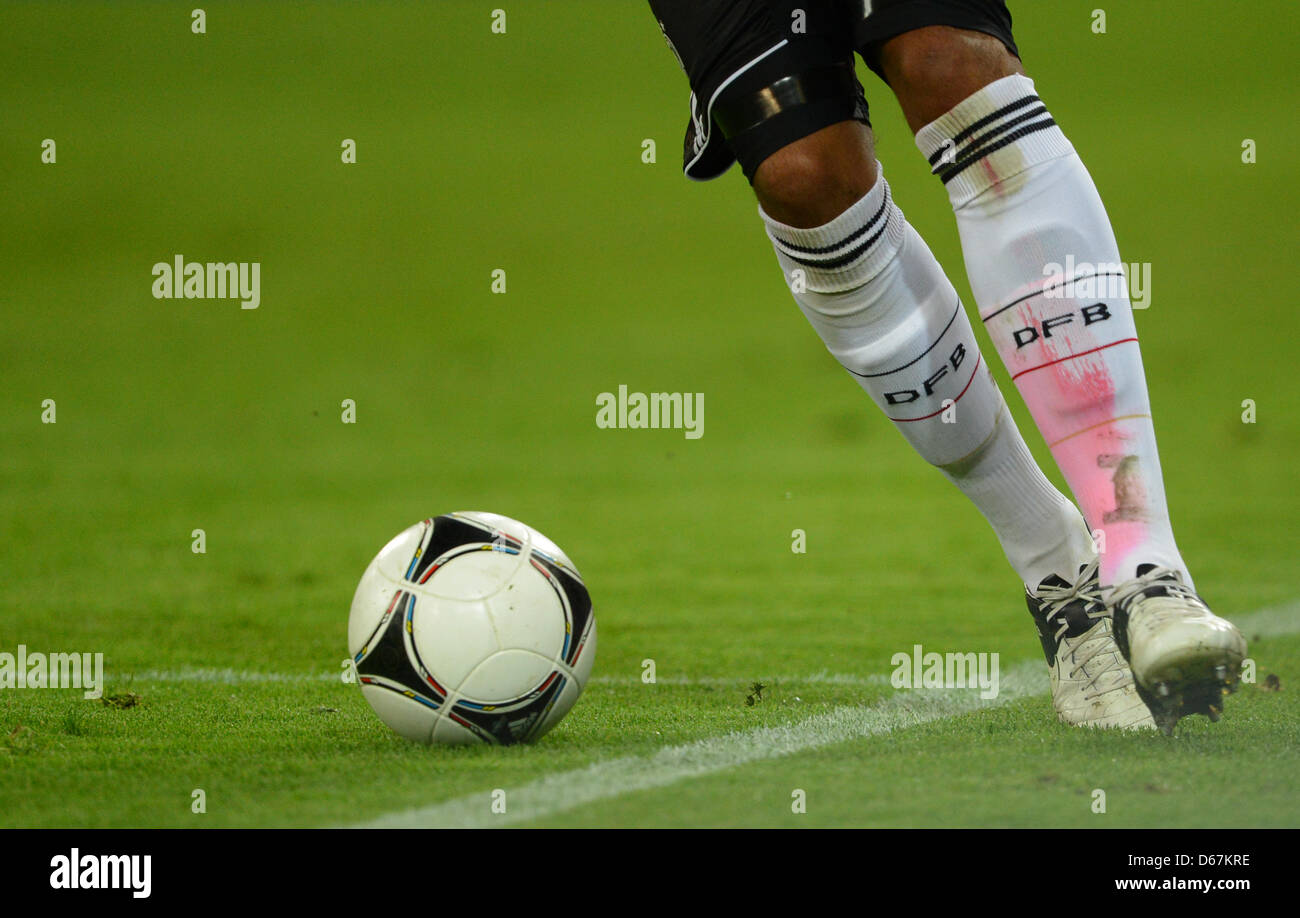 The legs of a German player during the UEFA EURO 2012 quarter-final ...