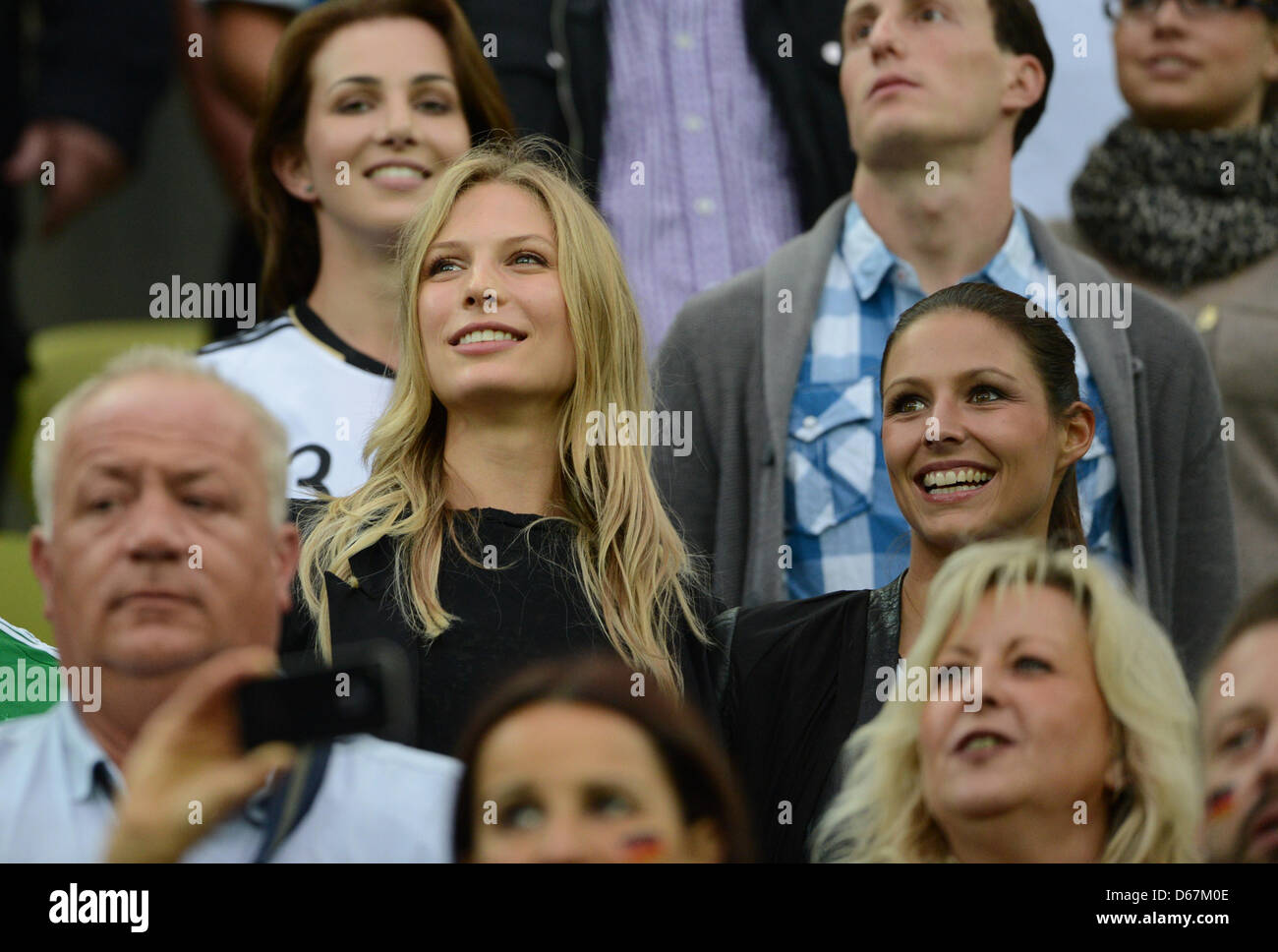 Lisa Mueller (L backgroud), the wife of Thomas Mueller, Sarah Brandner ...