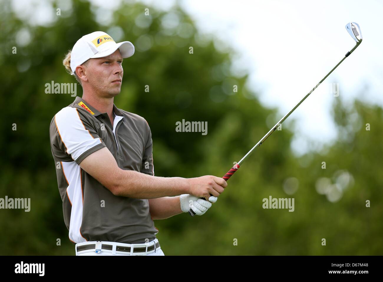 German golfer Marcel Siem watches his shot during the International ...