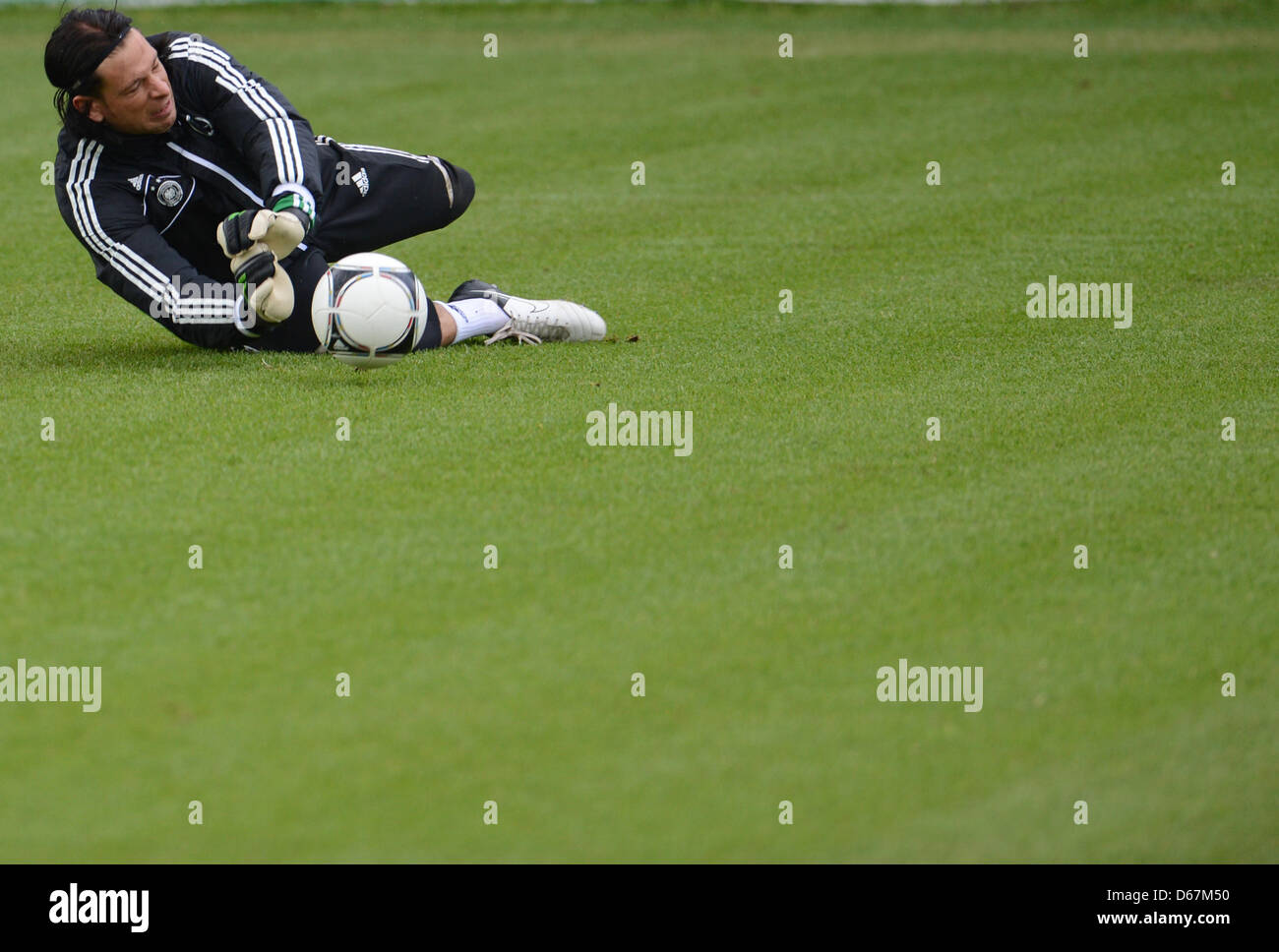 Germany's subsitute goalkeeper Tim Wiese catches a ball during a ...