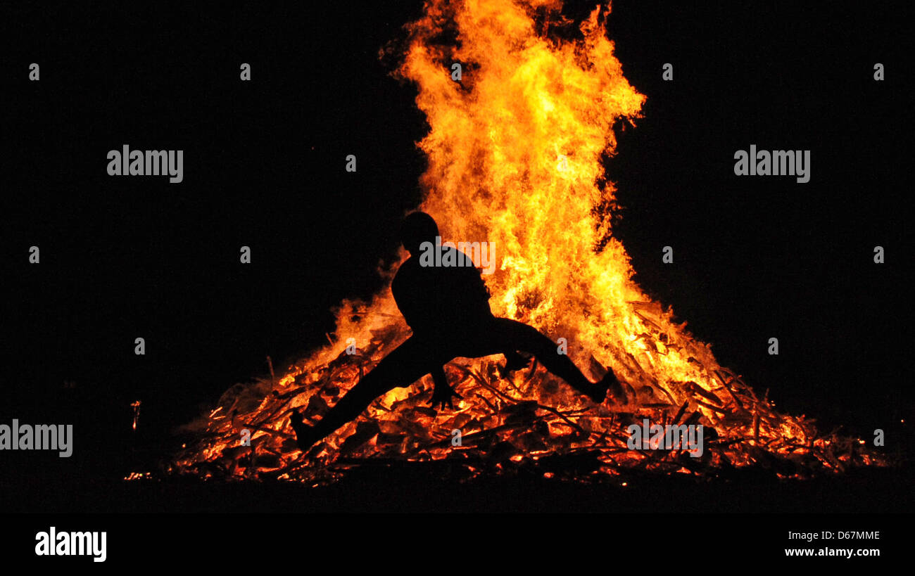 People dance around a midsummer fire in Freiburg, Germany, 23 June 2012 ...