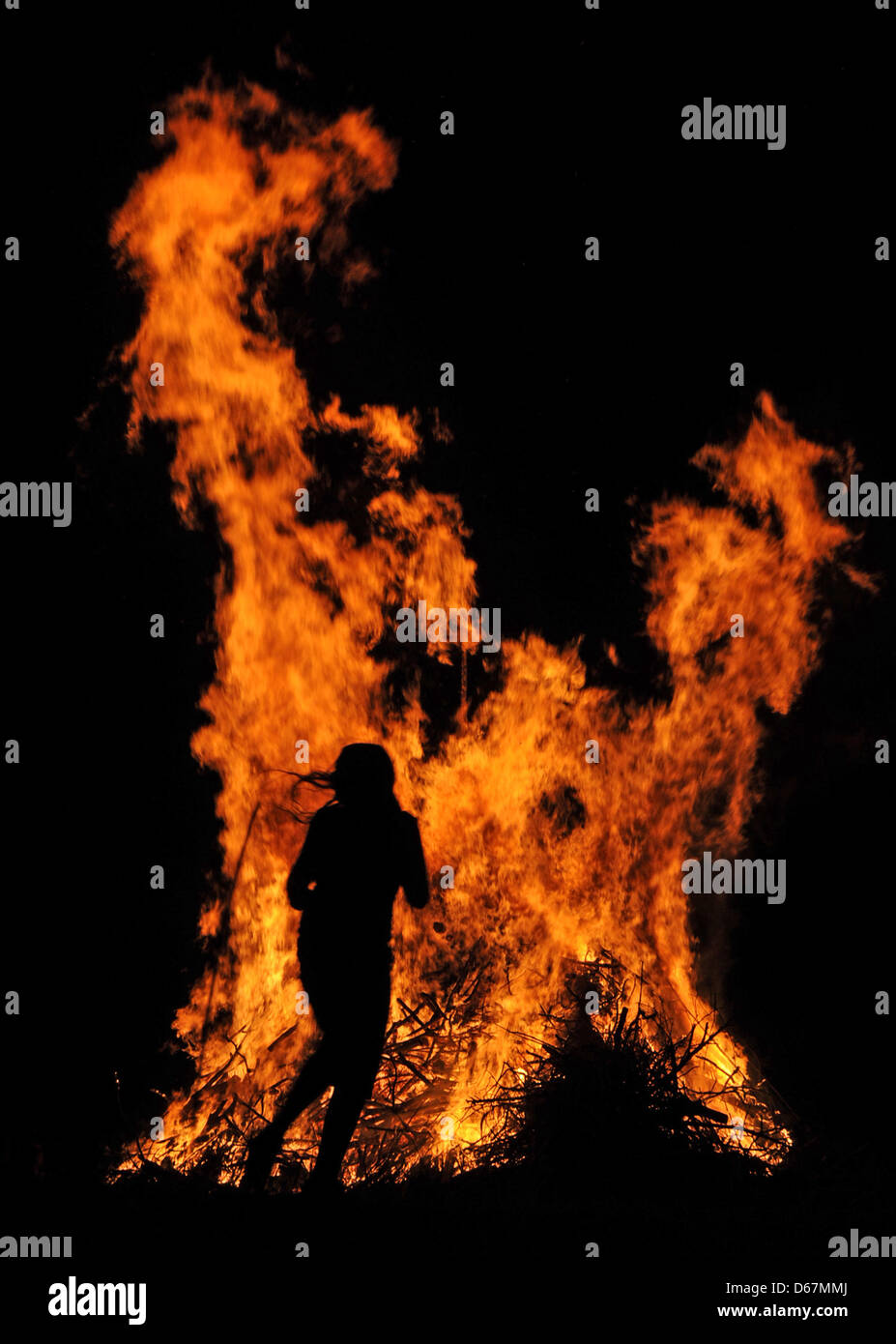 People dance around a midsummer fire in Freiburg, Germany, 23 June 2012 ...