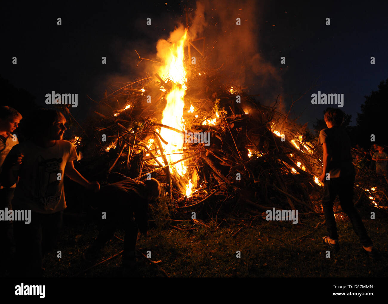 People dance around a midsummer fire in Freiburg, Germany, 23 June 2012 ...