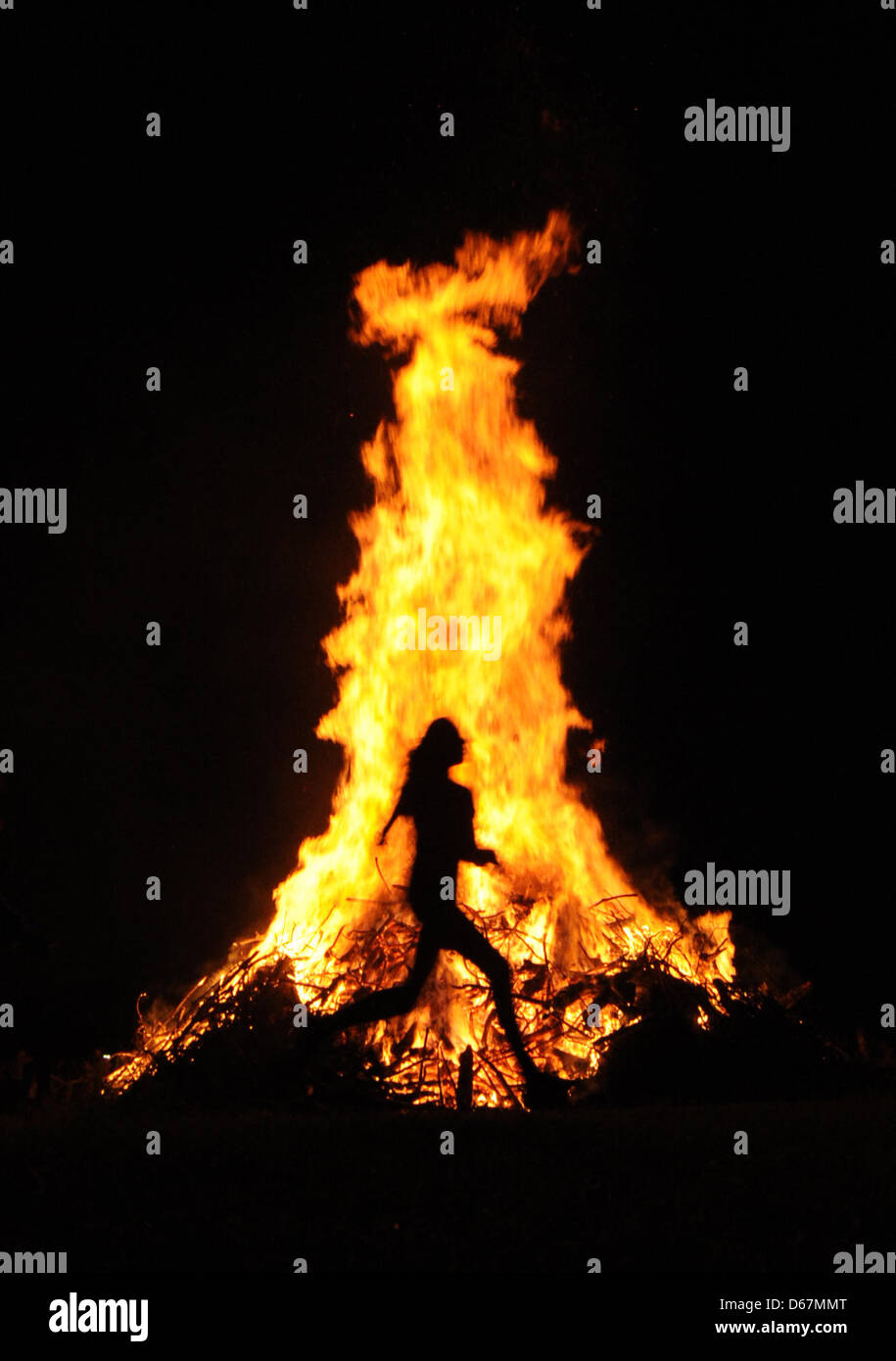 People dance around a midsummer fire in Freiburg, Germany, 23 June 2012 ...