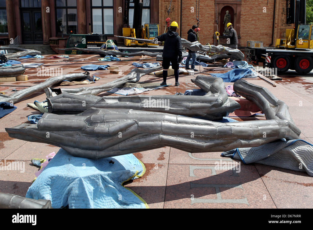 Workers dissemble and wrap the spider sculpture 'Maman' by French ...